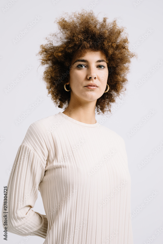Curly model posing at camera Stock Photo | Adobe Stock