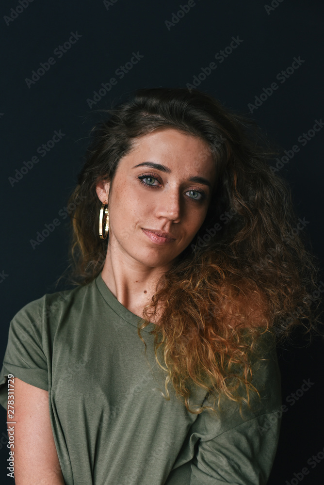 Portrait of a woman against black background Stock Photo | Adobe Stock