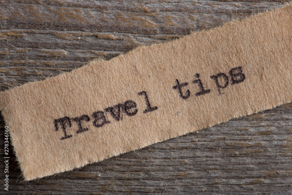 Travel and adventure concept, travel tips text on a piece of paper ...