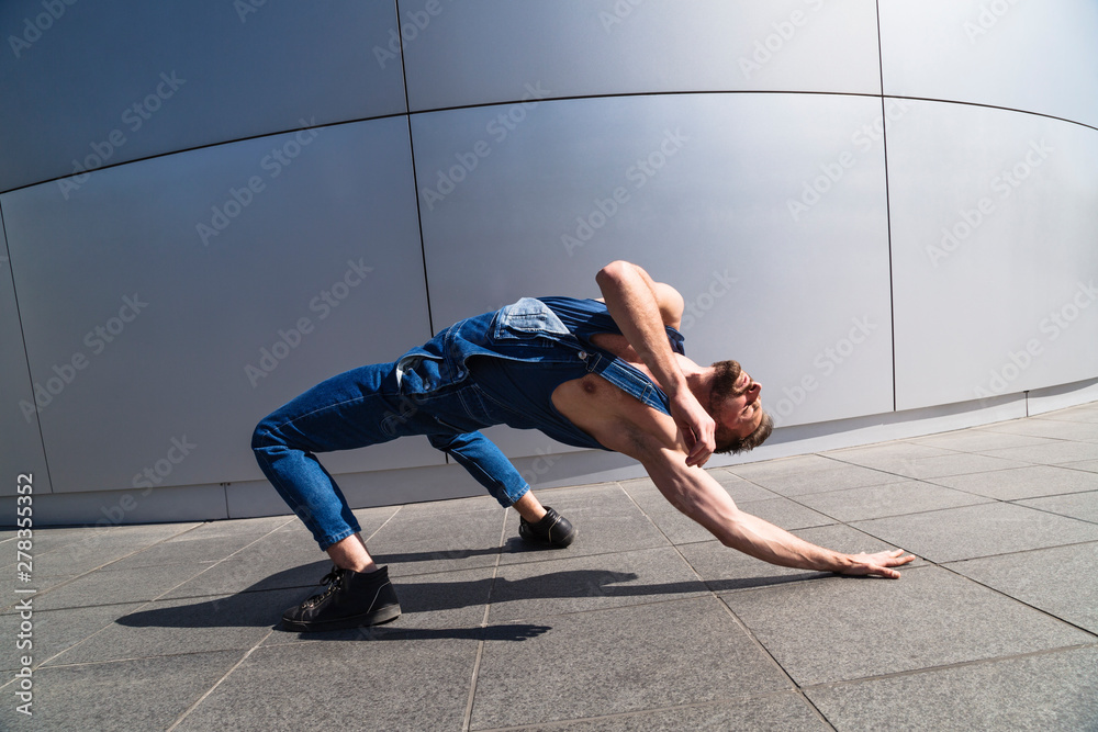 Man dancing modern dance using bridge pose Stock Photo | Adobe Stock