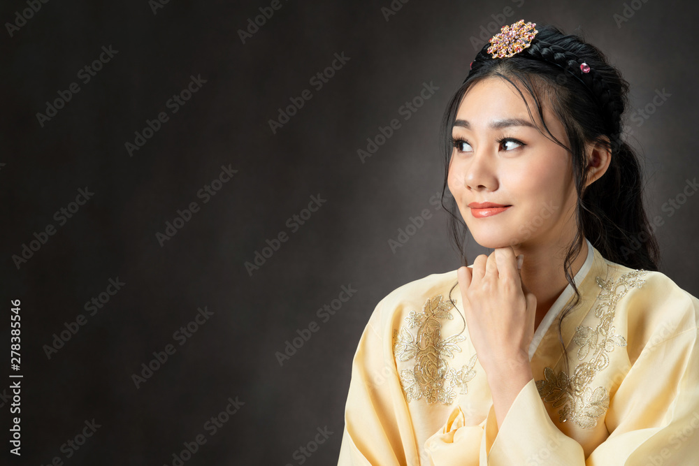 Korean woman wearing traditional korean dress (Hanbok) on black ...