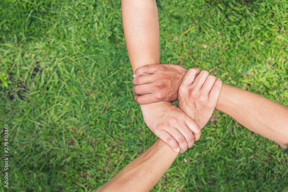 Authentic triangle partners hands together concept. Three hands holding ...