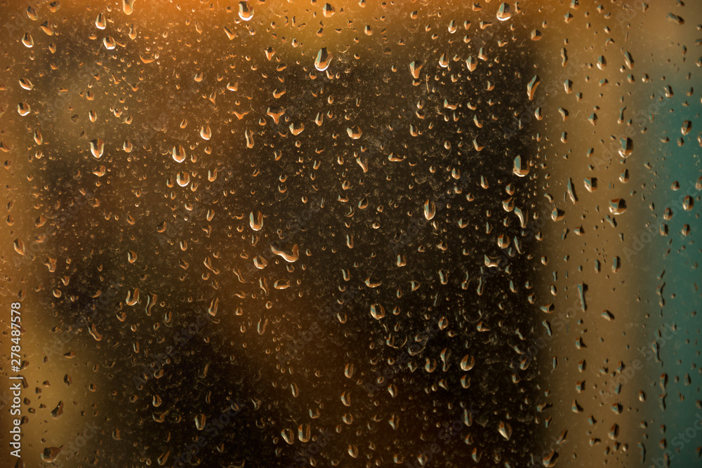 texture of rain drops on dirty window glass over blur and cloudy sunset ...