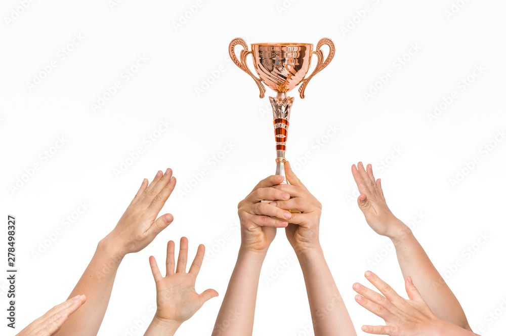 Winner is holding trophy in hands - many hands raised up Stock Photo ...