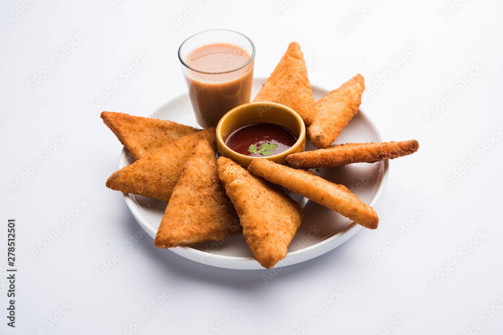 crispy Potato triangles or batata vada covered with bread crumbs and ...