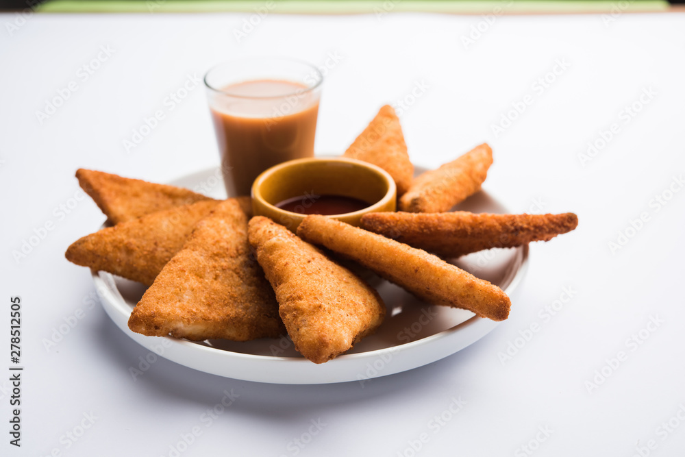 crispy Potato triangles or batata vada covered with bread crumbs and ...