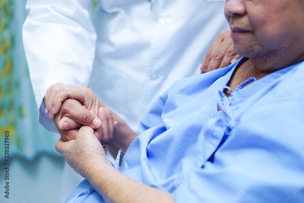 Doctor holding touching hands Asian elderly woman patient with love ...