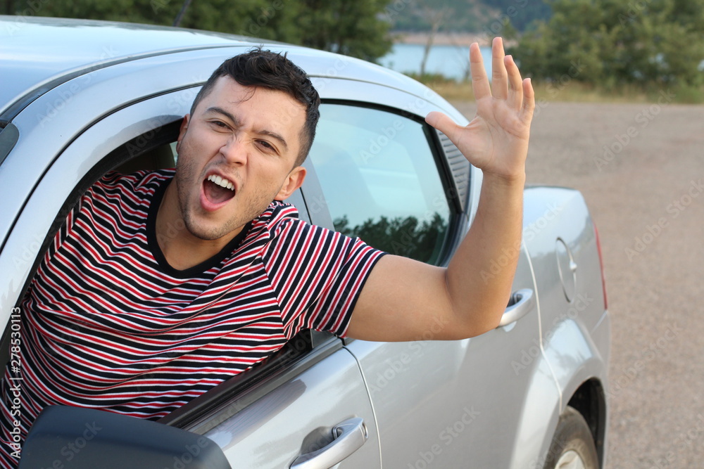 Angry young man driving a car Stock Photo | Adobe Stock