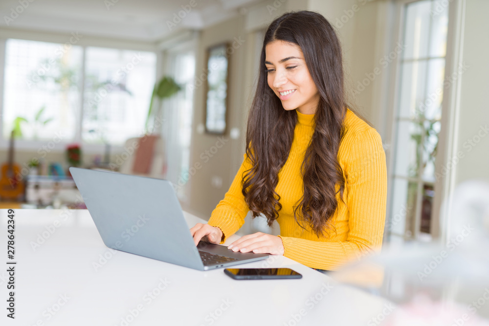 Beauitul young woman working using computer laptop concentrated and ...