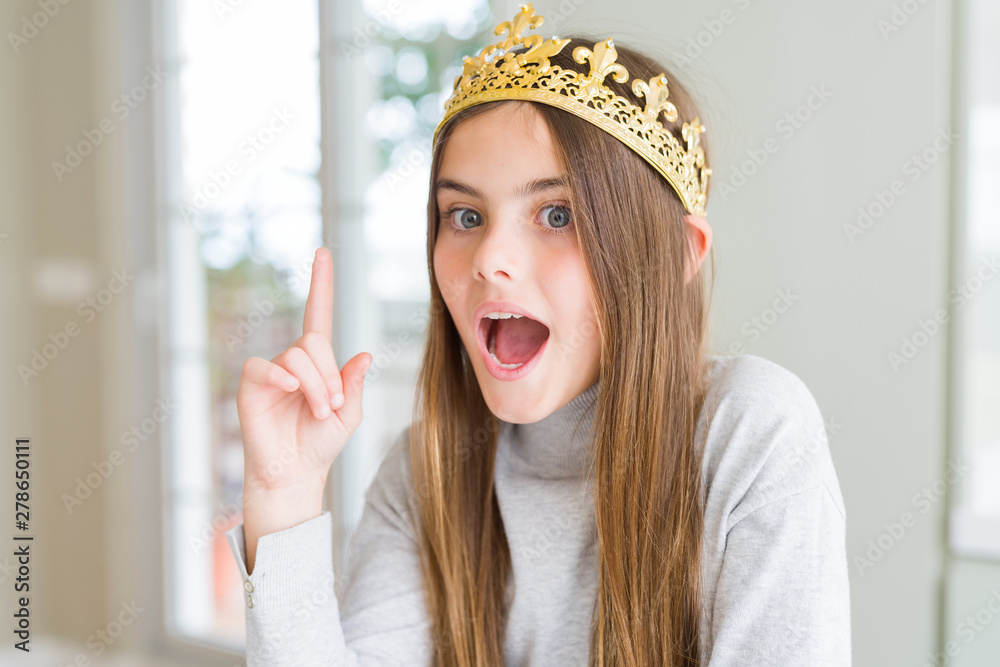 Beautiful young girl wearing a golden crown as a princess from ...