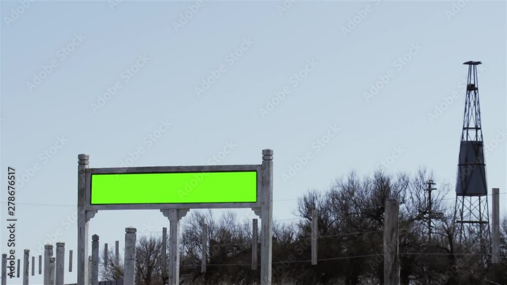 Old Wooden Road Sign with Green Screen. You can replace green screen ...