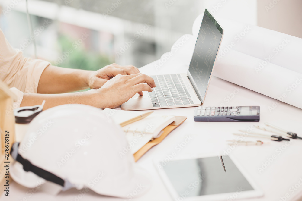 Professional Architecture Engineer Home designer using laptop computer ...