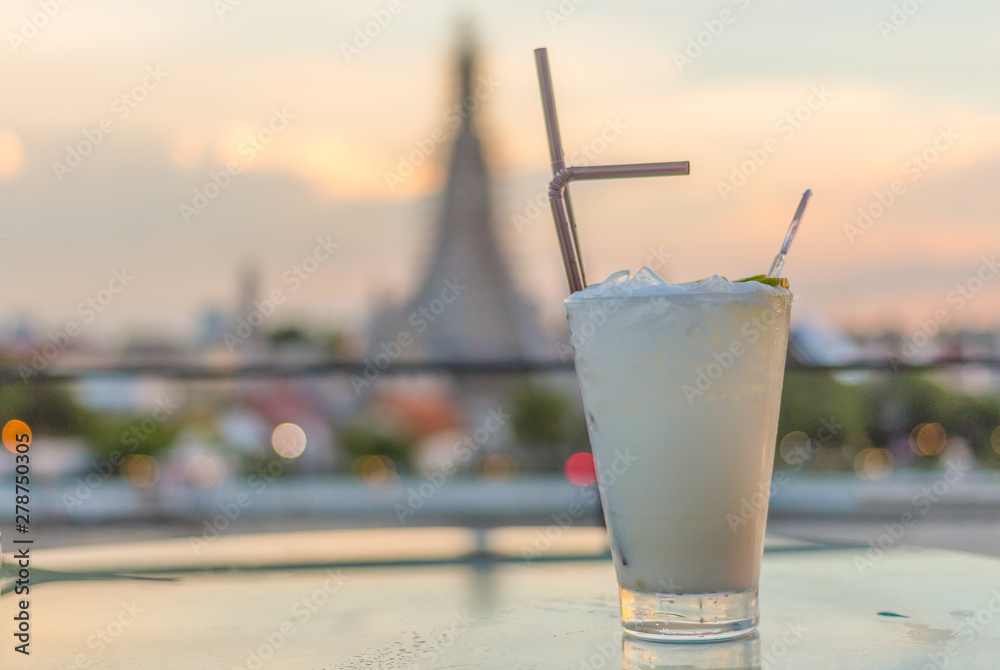 cocktail on table in rooftop bar with famous place background. Stock ...