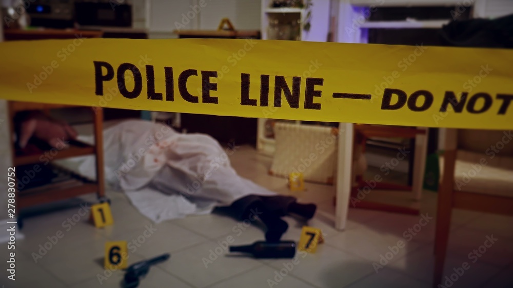 A crime scene in a kitchen with murder victim on the floor, covered ...