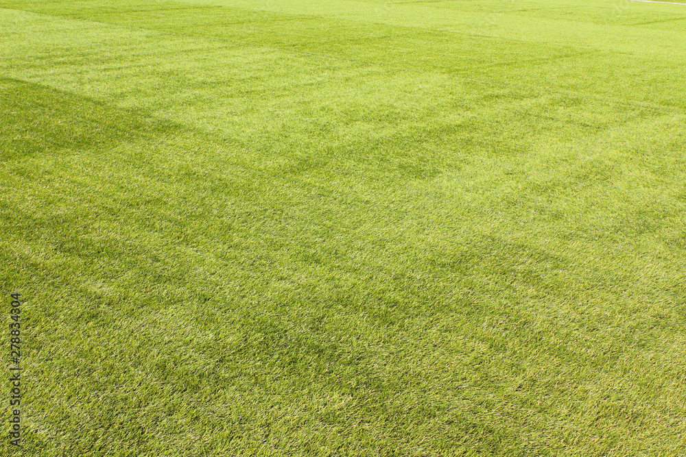 Artificial football field. Clean green lawn. Background. Texture. Stock ...