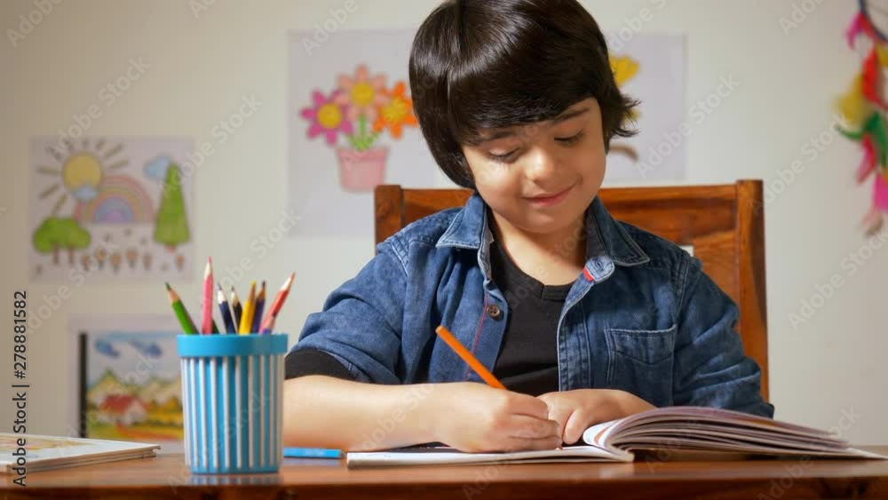 Little Indian boy sitting in his study room and studying - Drawing a ...