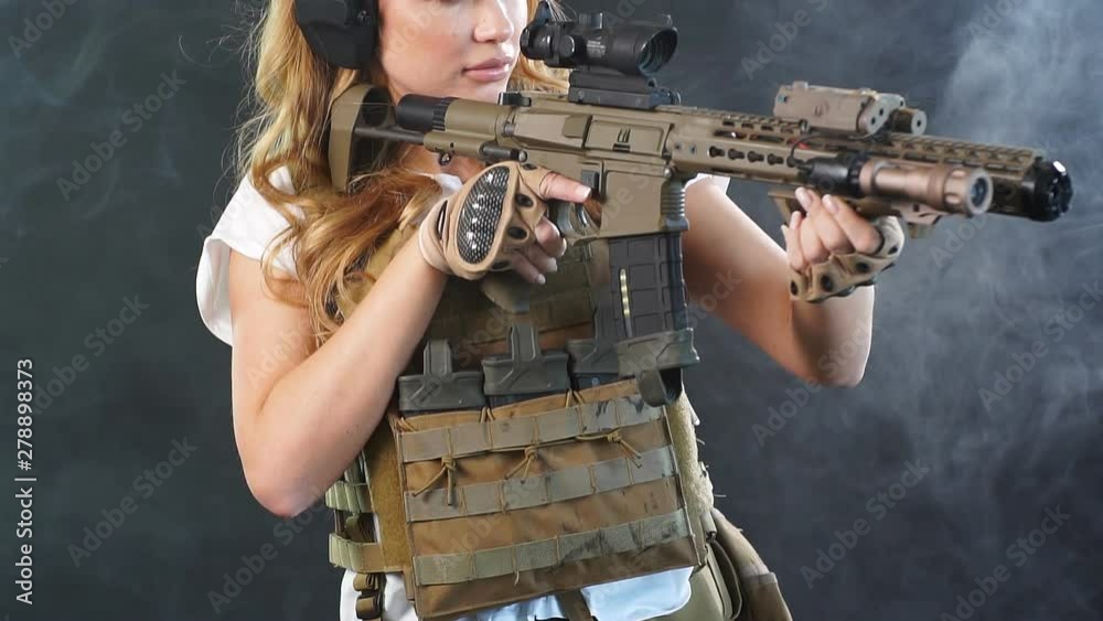 Woman sniper in body armour with sniper rifle. Female serving in Army ...