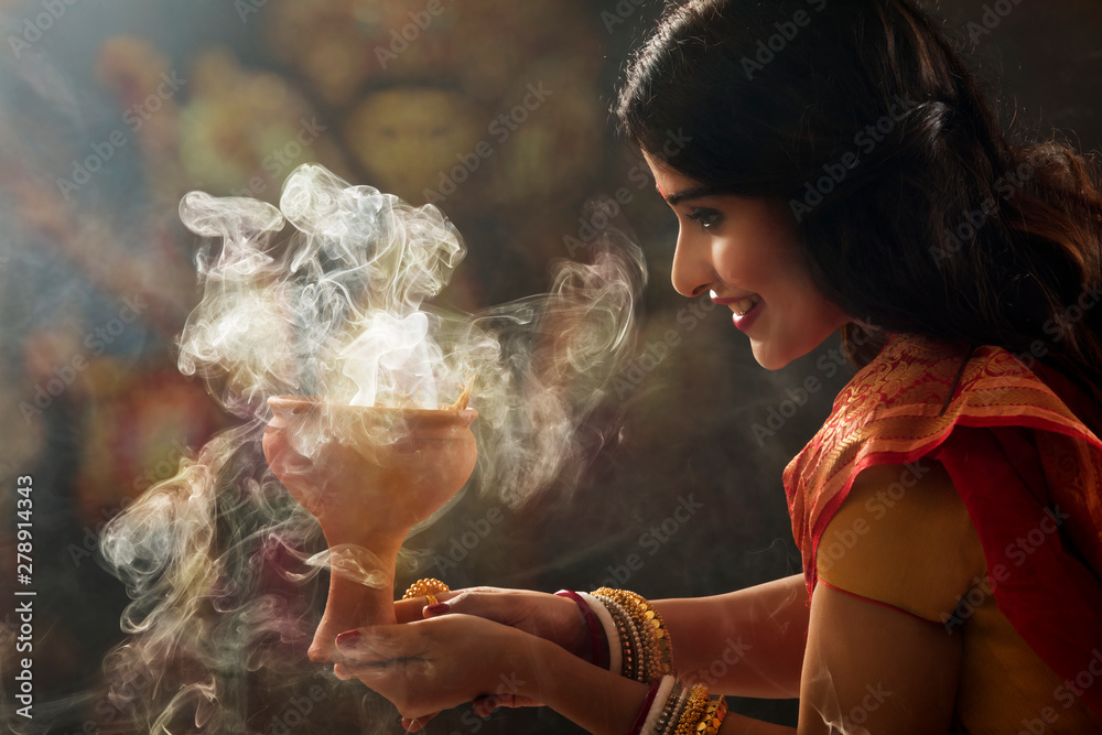 Bengali Married woman doing a Dhunuchi dance on the occasion of durga ...