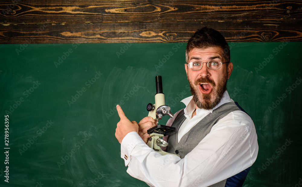 Biology or chemistry lesson in university. Student in classroom ...