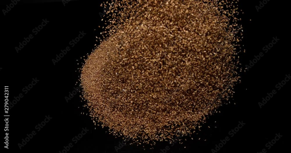 Gold Coloured Sesam, sesamum indicum, Seeds Exploding against Black ...