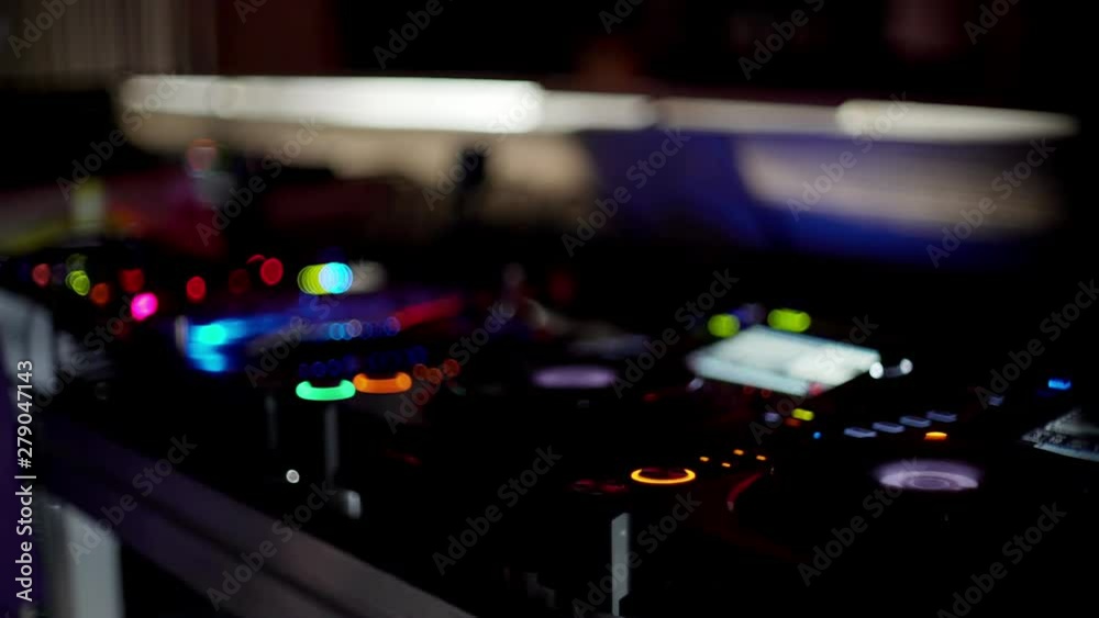 DJ Table with a multiple colourful lights, buttons, screen. Party ...