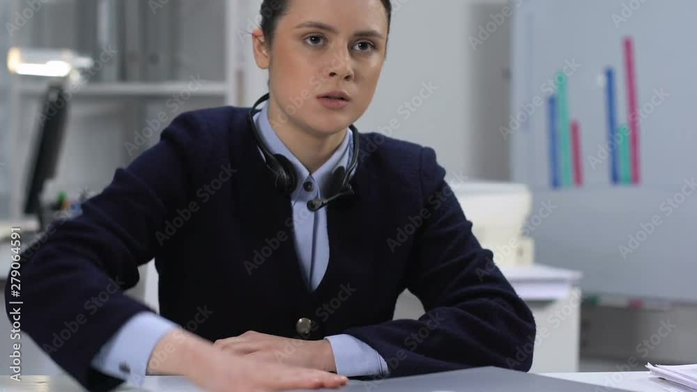 Angry female employee taking off headset closing laptop, work ...