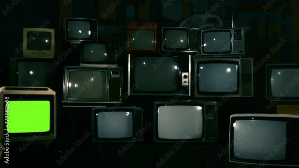 Pile of Old Retro TVs Screen from 80s and One TV turning Off Green ...