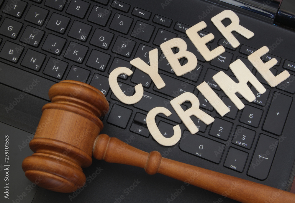 Cyber crime concept, judge gavel on laptop computer keyboardand words ...
