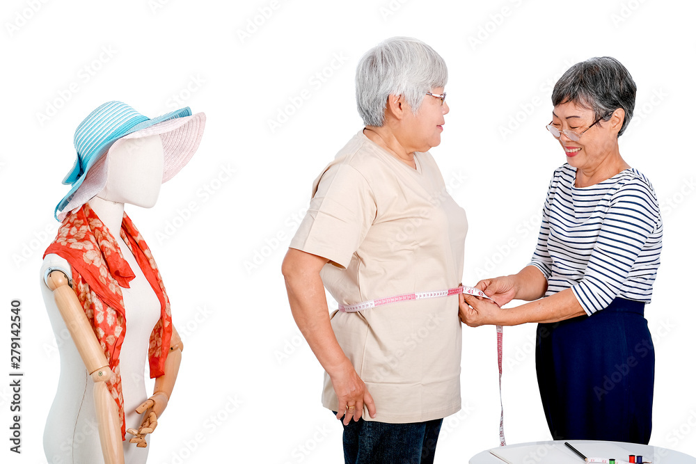 Asian elderly tailor woman show action of body measurement for the ...