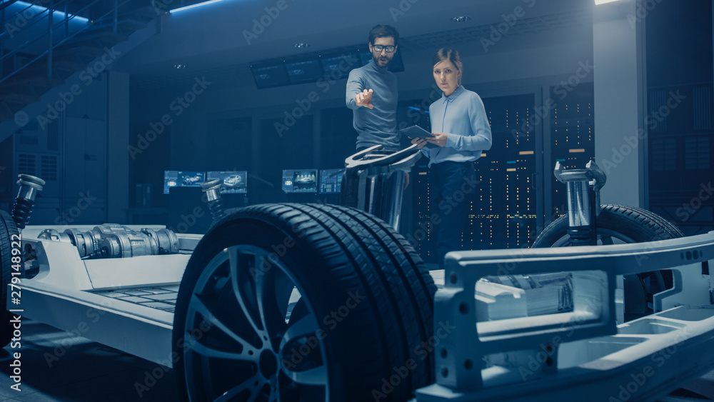 Fotografia do Stock: Automobile Mae and Female Design Engineers Working ...
