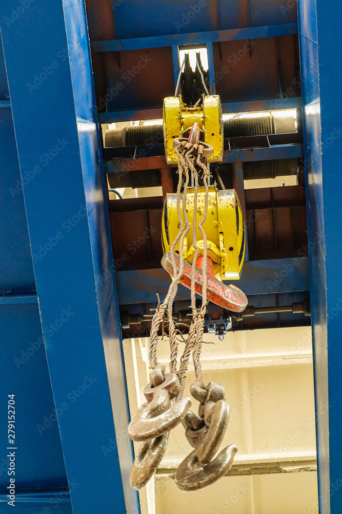 Overhead traveling crane with steel hooks in industrial engeenering ...