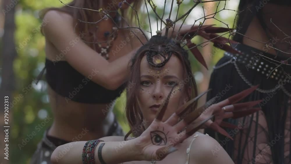 Portrait of young attractive woman in theatrical costume, hairstyle and ...