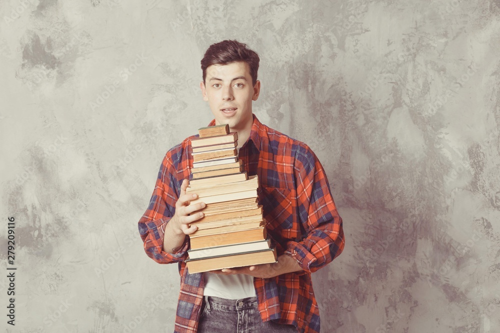 Young boy student hold many books. Guy want learning, have education ...