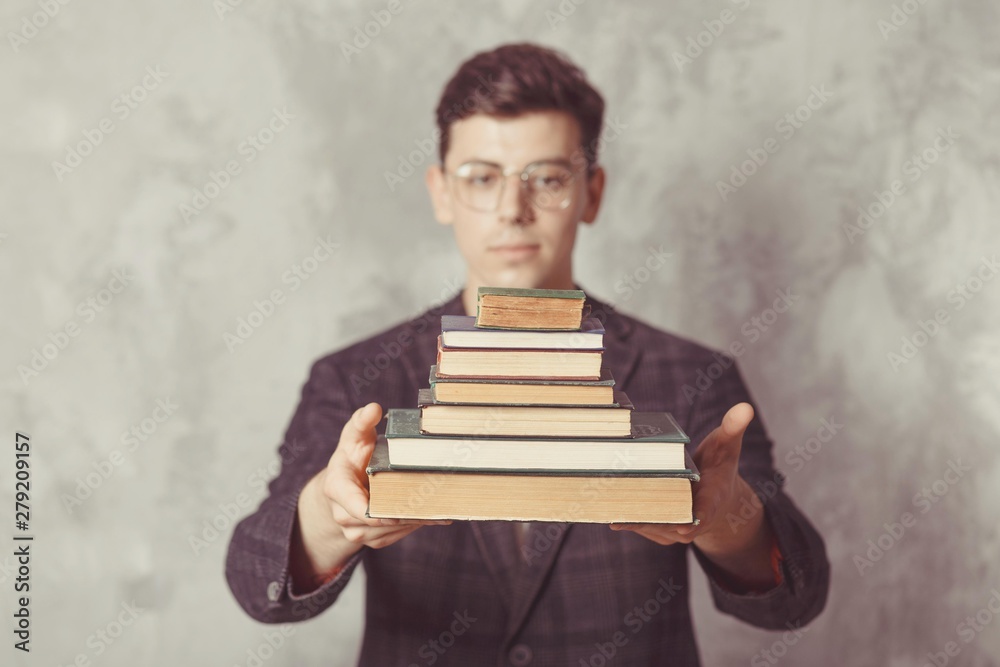 Young boy student with books in glasses. happy guy want learning, have ...