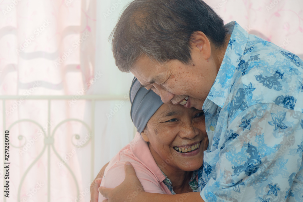 Asian senior cancer patien during chemotherapy feel happy with big hug ...