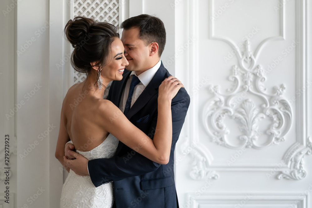 bride and groom hugging passionately. newlyweds Close to each other ...