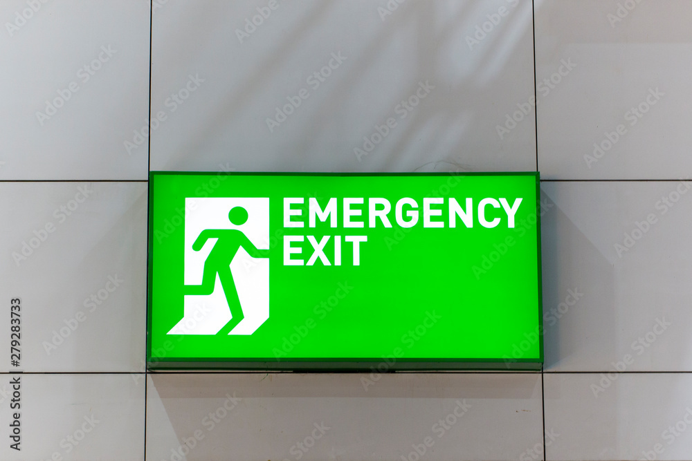 Emergency exit signs in the hotel stairs Stock Photo | Adobe Stock