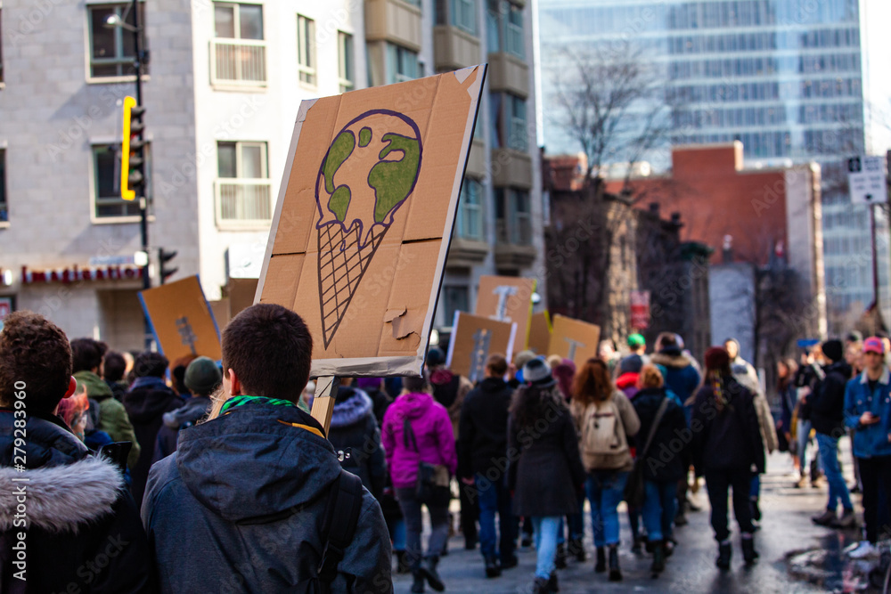 Activists unite at climate change march. A close up view of a homemade ...
