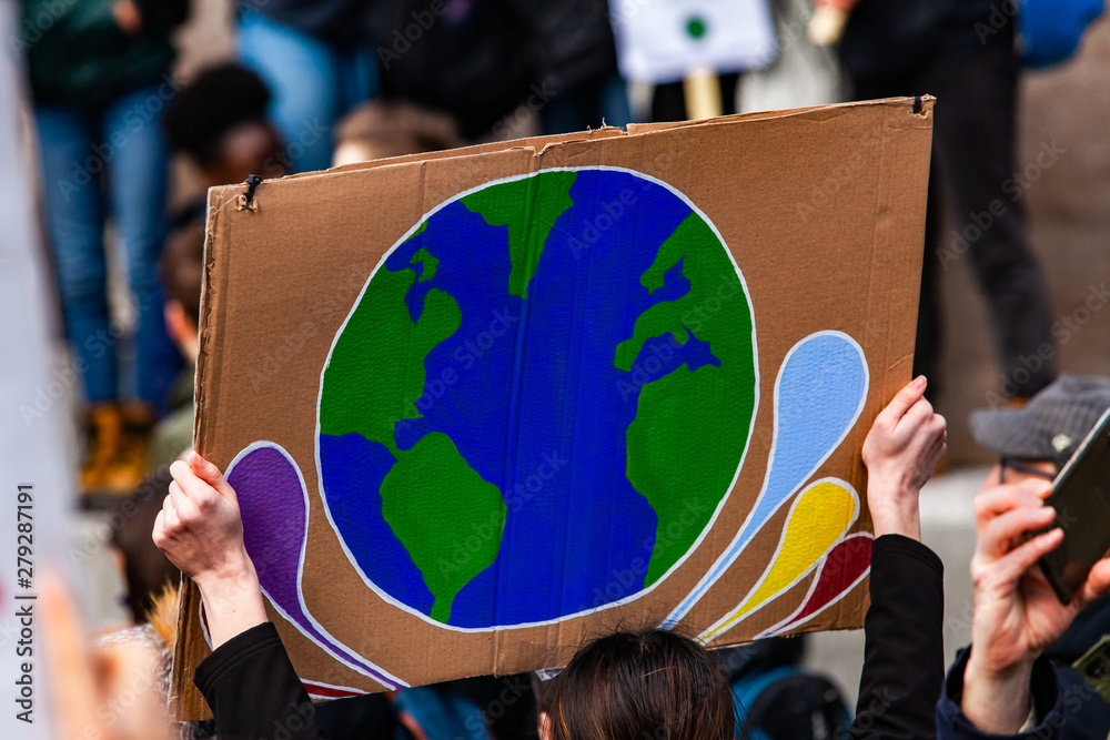 Ecological activists stage demonstration. A homemade poster depicting ...