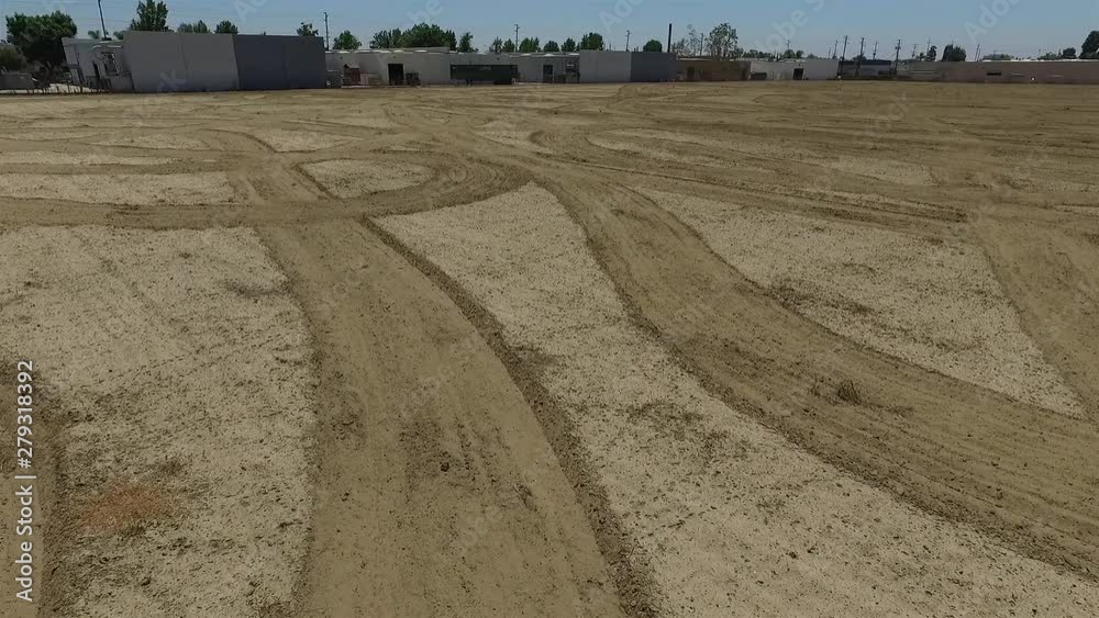 Wideo Stock: Slow motion aerial drone flying low over empty industrial ...