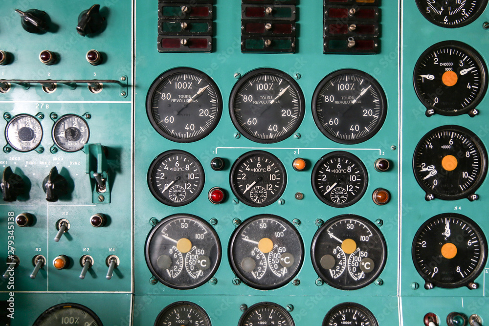 background of control panel in the cockpit. lights, analog gauges, and ...