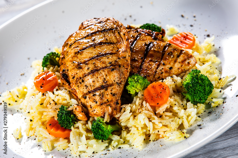 Grilled chicken fillets, rice and vegetables Stock Photo | Adobe Stock