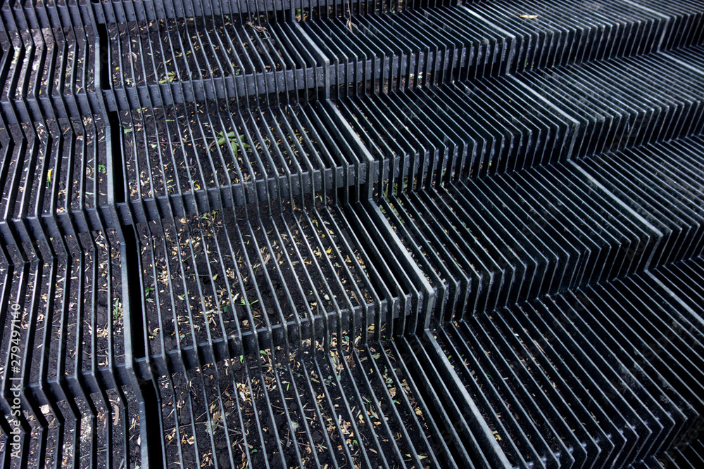 Outside metal stairs framework. Steps from iron straps and gaps ...