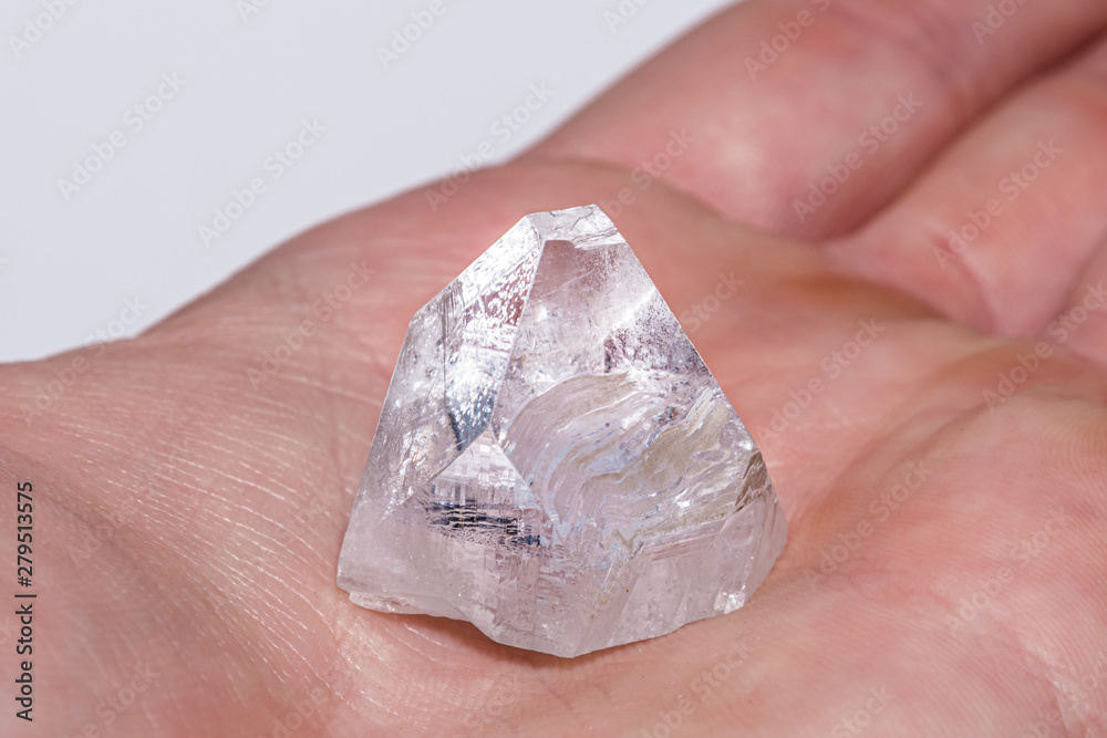 Rough diamond formed by volcanic heat and pressure inside earth in hand ...