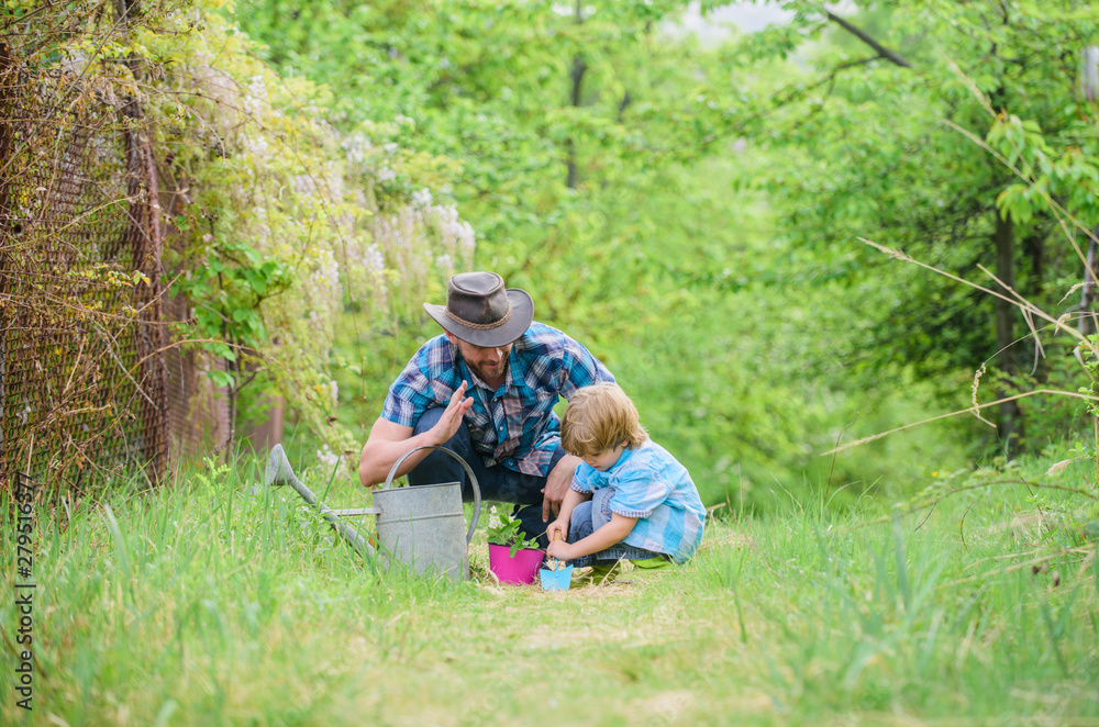 Respecting ecology. small boy child help father in farming. Eco farm ...