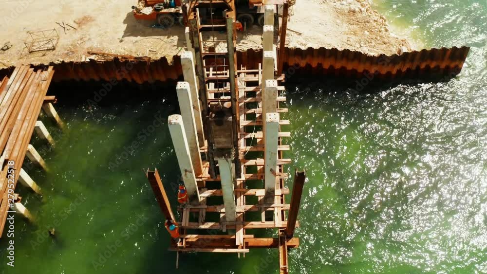 Pile driving is installing concrete pile. Heavy construction equipment ...