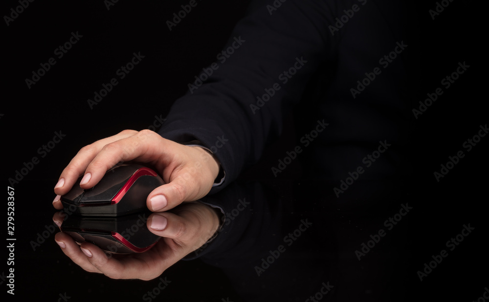 Hand using wireless mouse in a dark environment Stock Photo | Adobe Stock