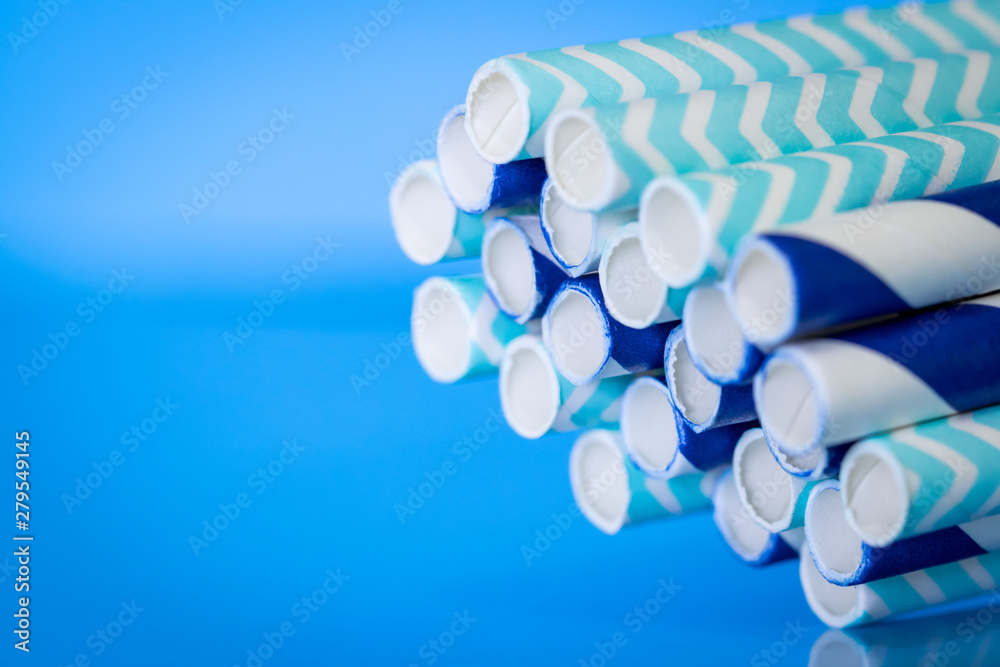 Blue Plastic Drinking Straws on a Blue Background Stock Photo | Adobe Stock