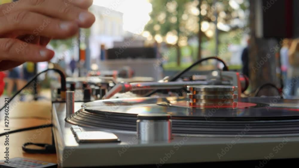 DJ plays a set at a party. Open Air on the summer terrace of a ...