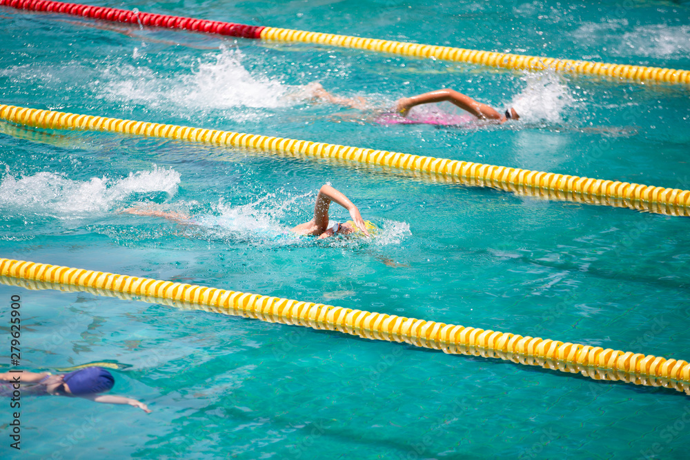 Athlete in freestyle swimming race in swimming pool Stock Photo | Adobe ...
